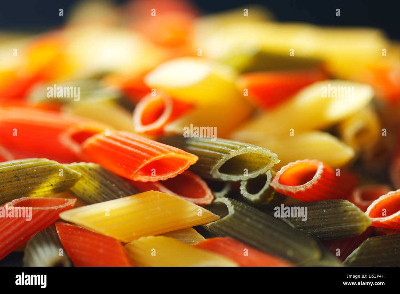 Colored dry italian pasta background Stock Photo - Alamy