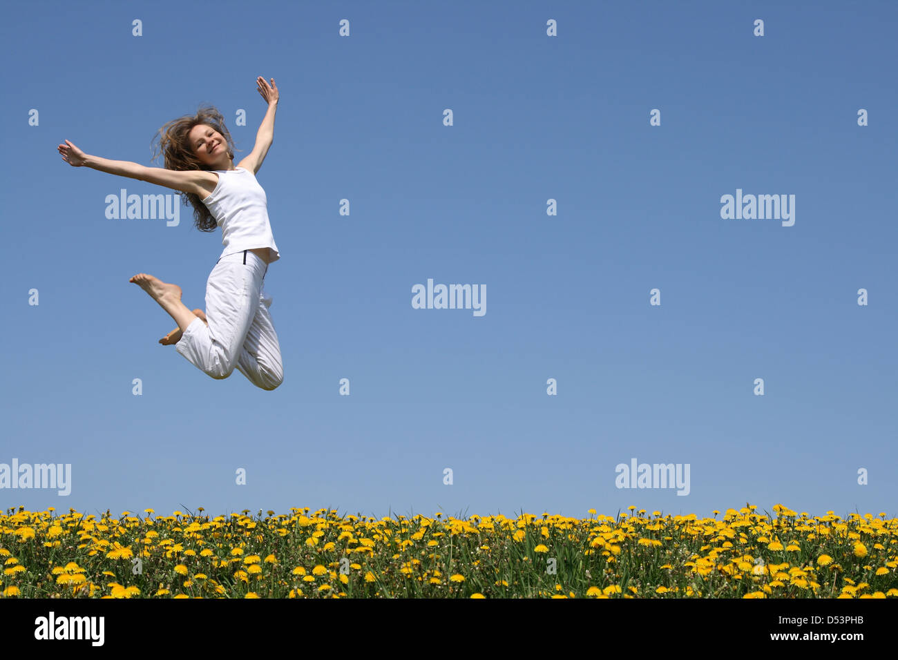 Smiling pretty woman in a beautiful jump Stock Photo - Alamy