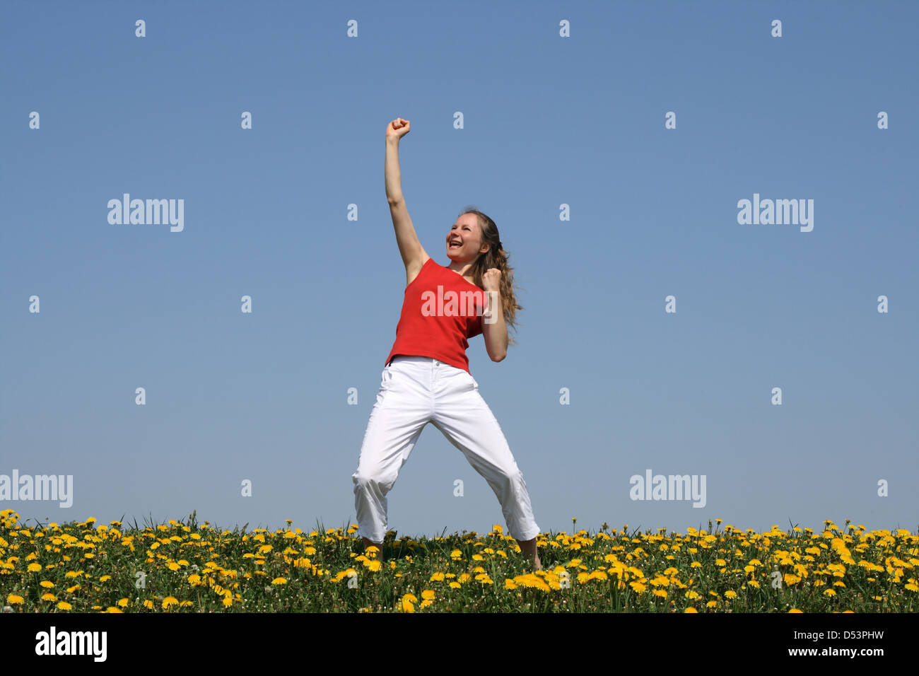 Winner concept. Young woman yelling "yeah!" in joy Stock Photo - Alamy