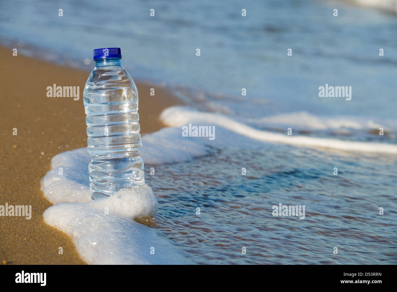 Fresh water on a sunny beach in summertime Stock Photo - Alamy