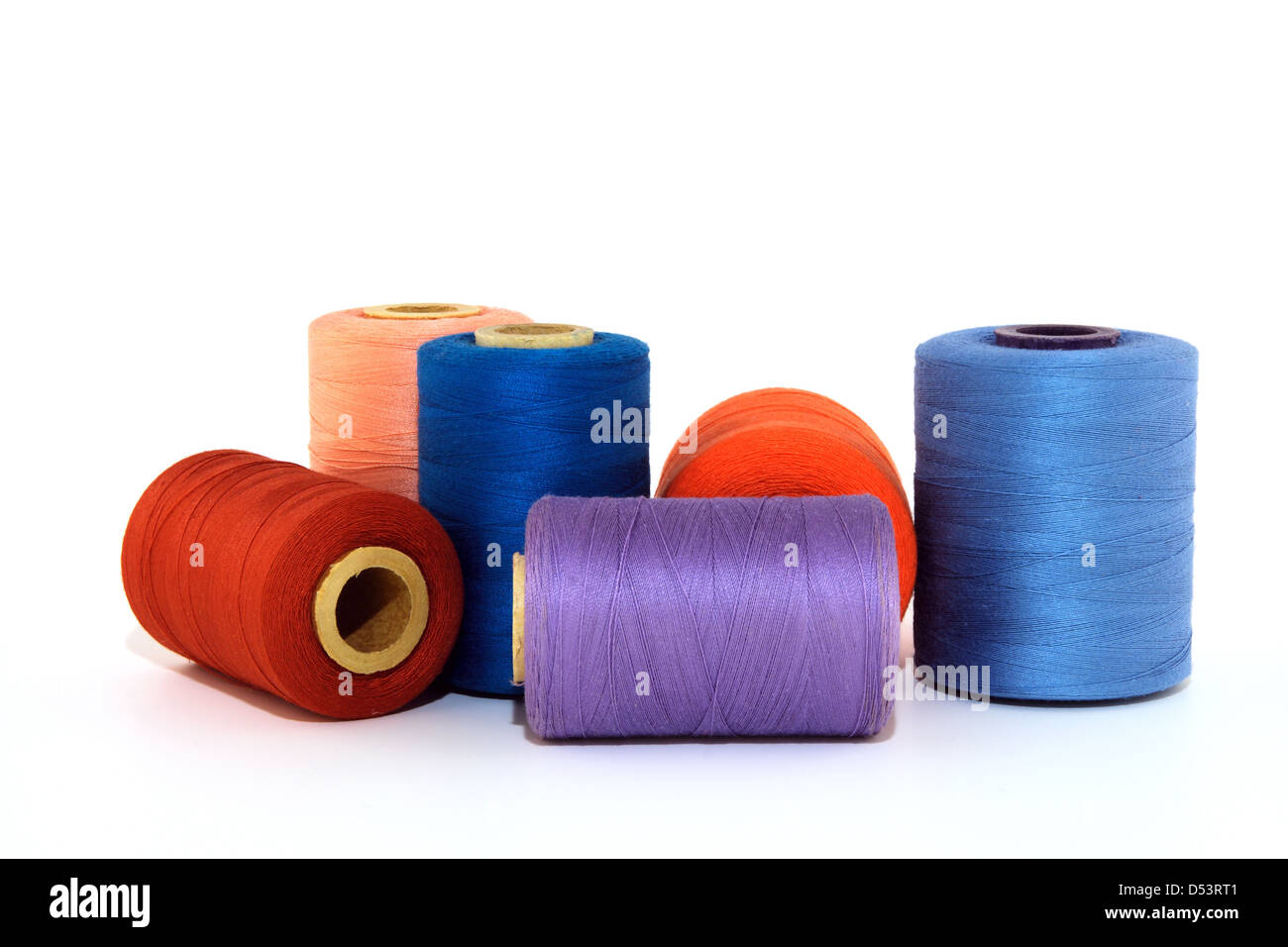 Colorful thread bobbins, isolated on white background Stock Photo - Alamy