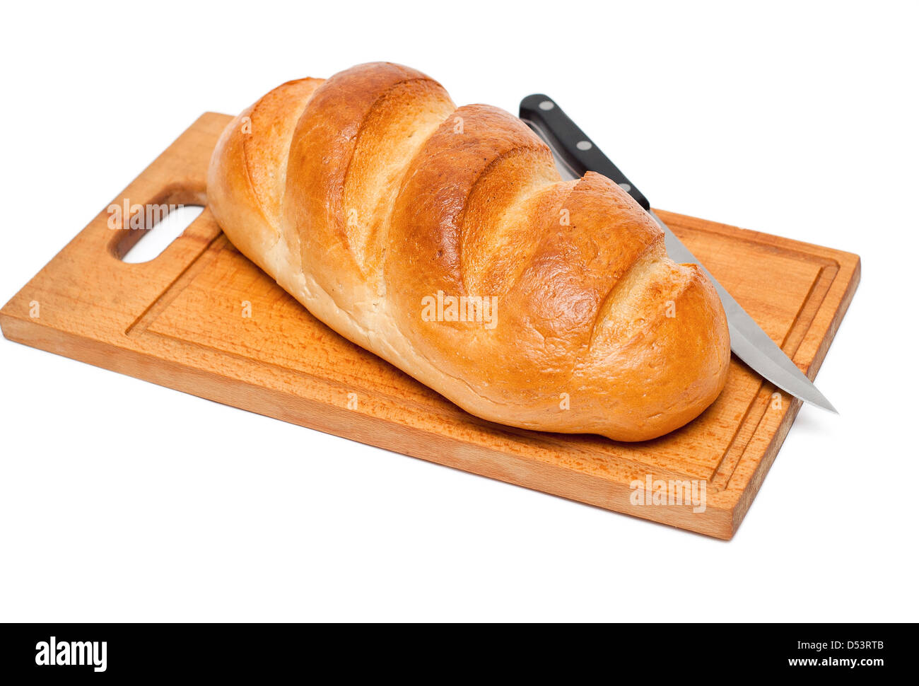 fresh bread with knife on breadboard Stock Photo - Alamy
