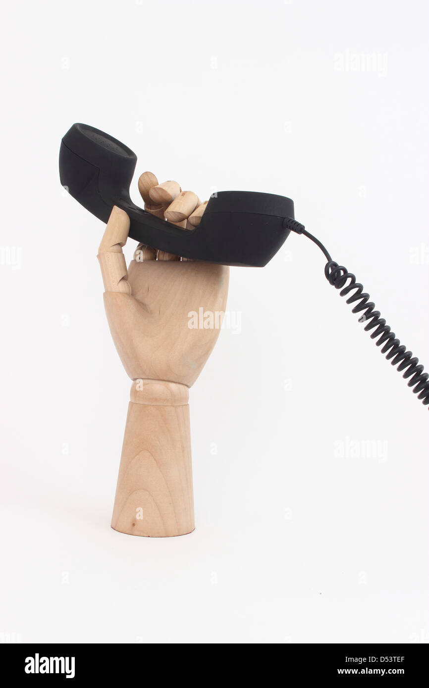 wooden hand with wired telephone isolated Stock Photo - Alamy
