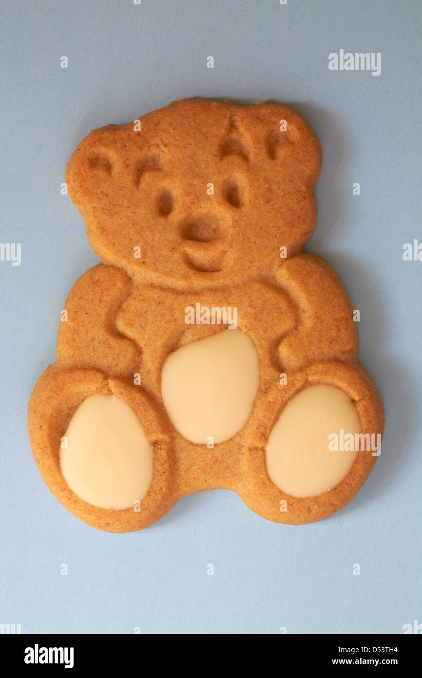 Teddy bear biscuit isolated on pale blue background Stock Photo - Alamy
