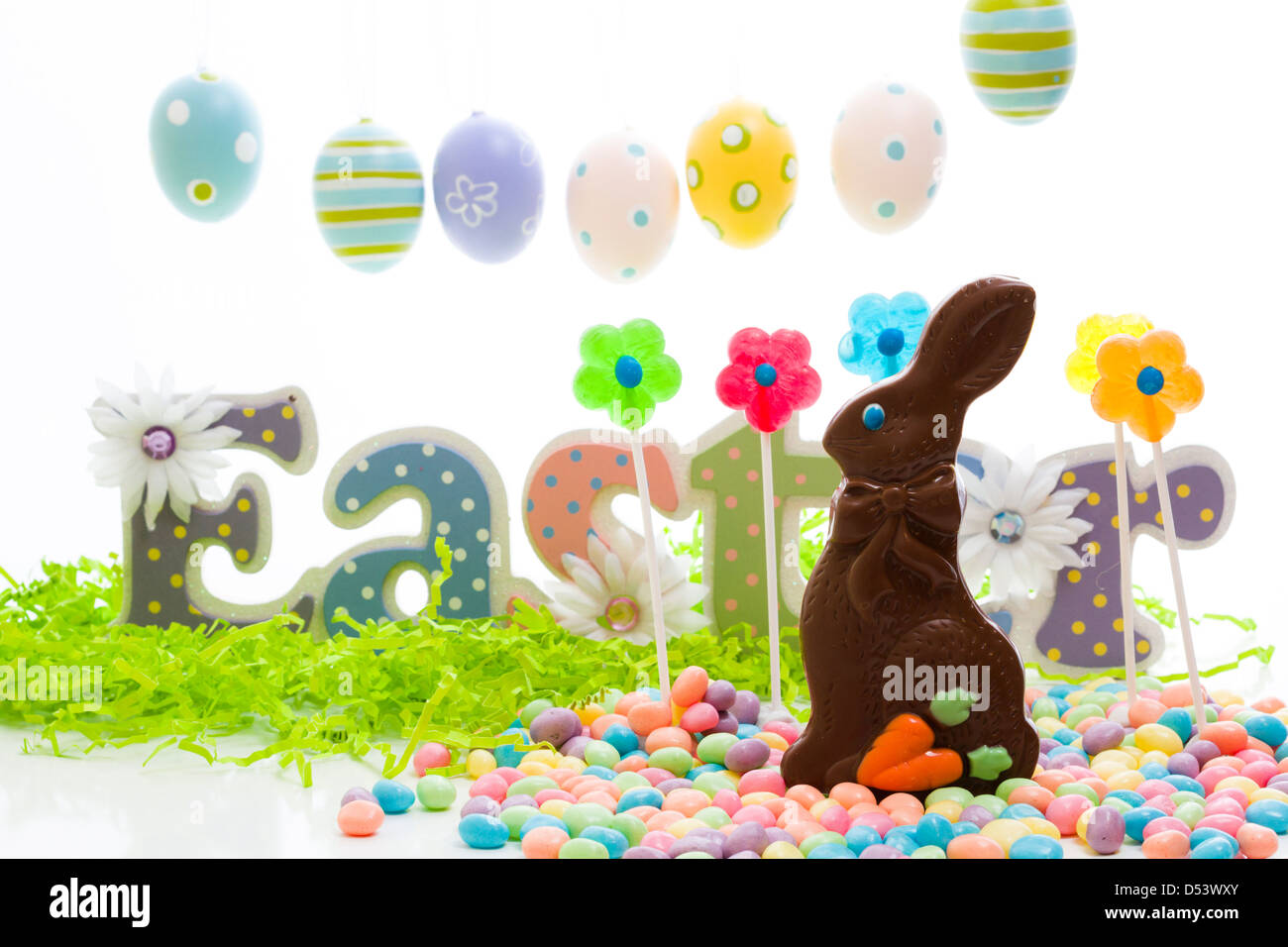 Chocolate Easter bunny with other Easter candies Stock Photo - Alamy