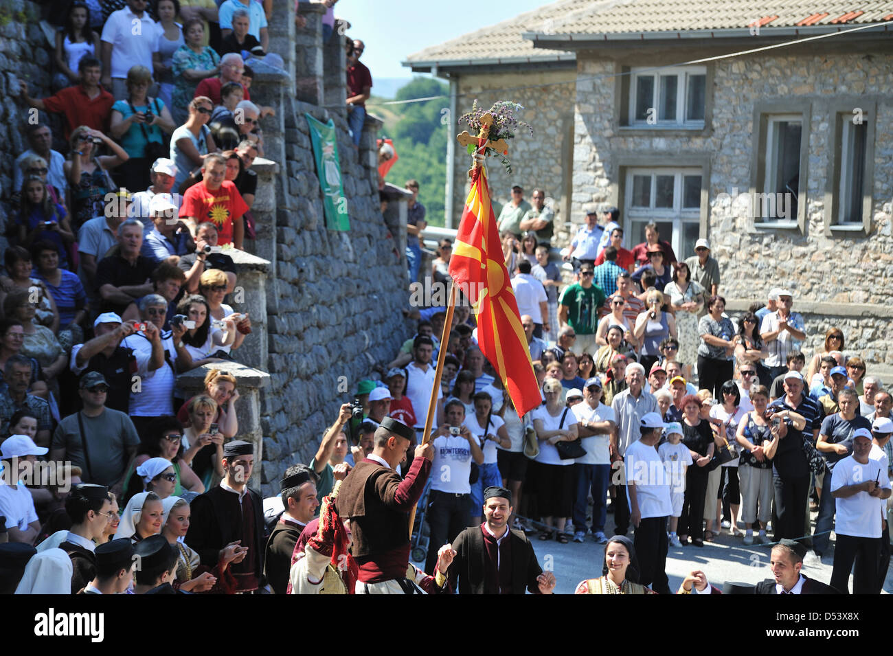 Procession with a flag is part of the celebration of Galicnik Wedding ...