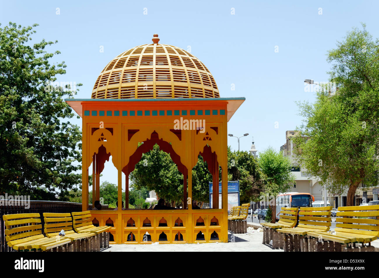 Aswan. Egypt. View of a colourful bus stop shelter on the main avenue ...