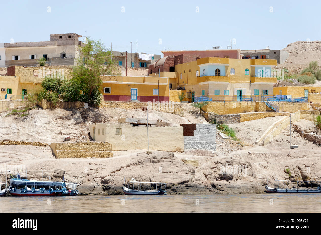 Aswan. Egypt. View of colourful Nubian houses beside the River Nile ...