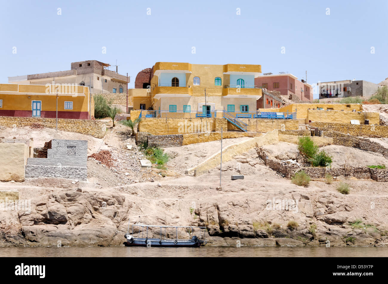Aswan. Egypt. View of colourful Nubian houses beside the River Nile ...