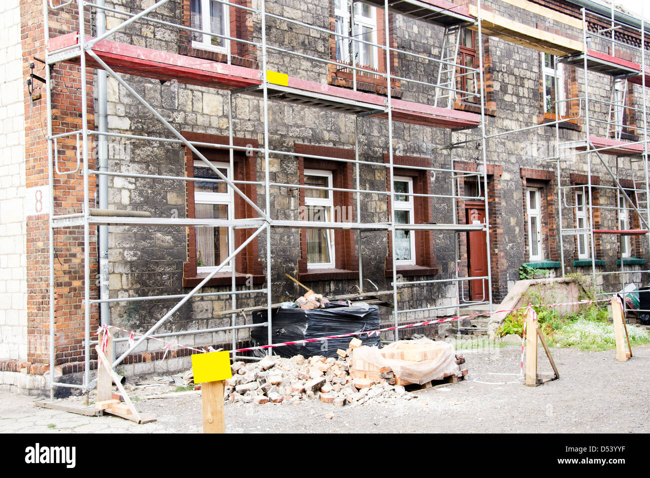 Photo of building with scaffolding during renovation Stock Photo - Alamy