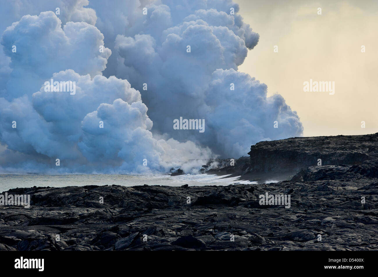 Steam rising into the sky from lava from the Kilauea volcano in Hawaii ...