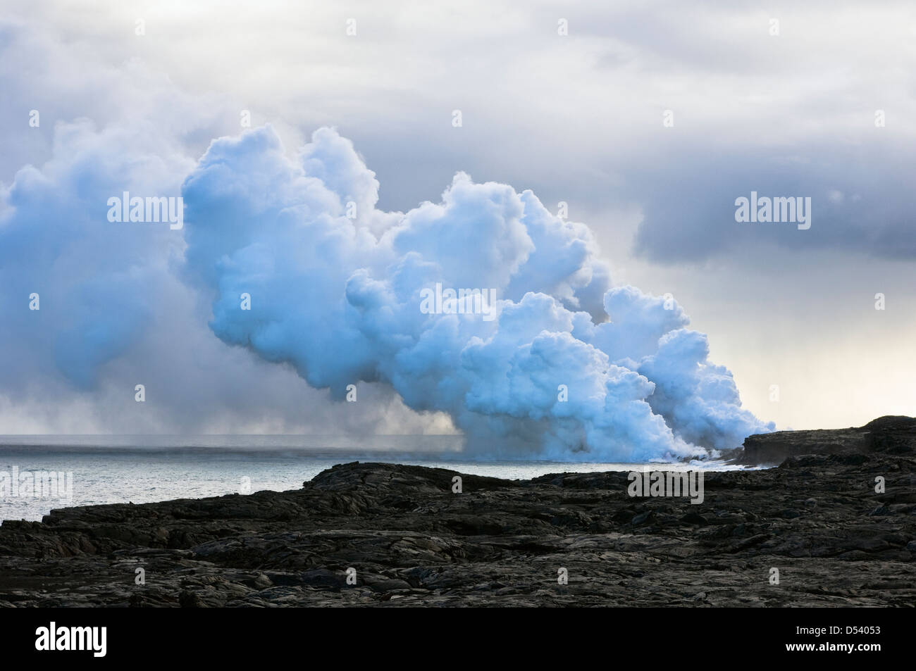 Steam rising into the sky from lava from the Kilauea volcano in Hawaii ...