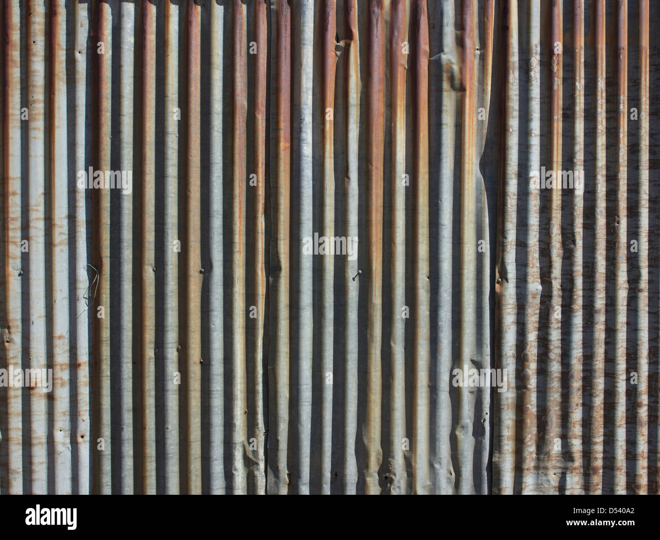 A rusty corrugated iron metal fence close up/ Zinc wall Stock Photo - Alamy