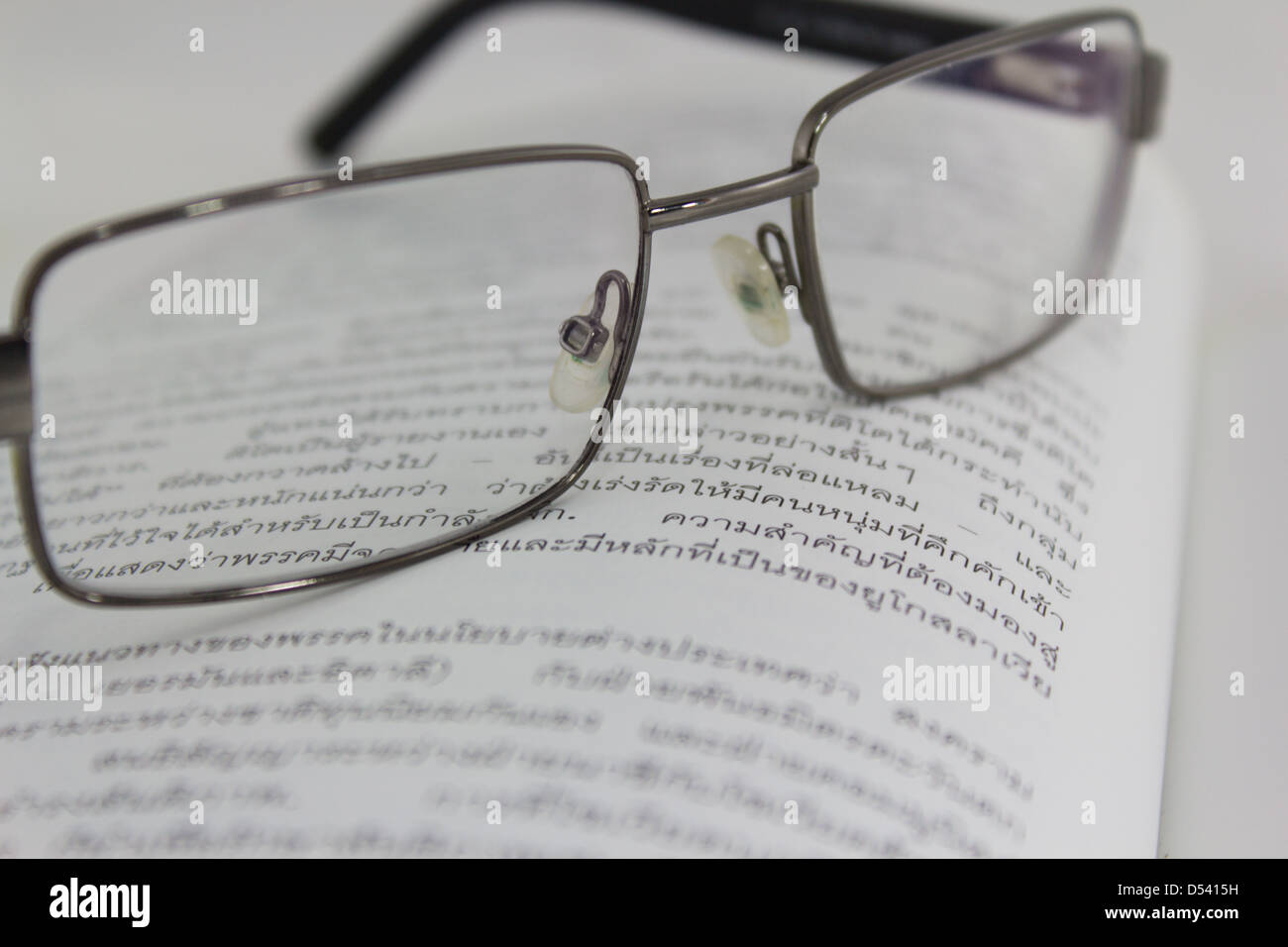 Open book with glasses hi-res stock photography and images - Alamy