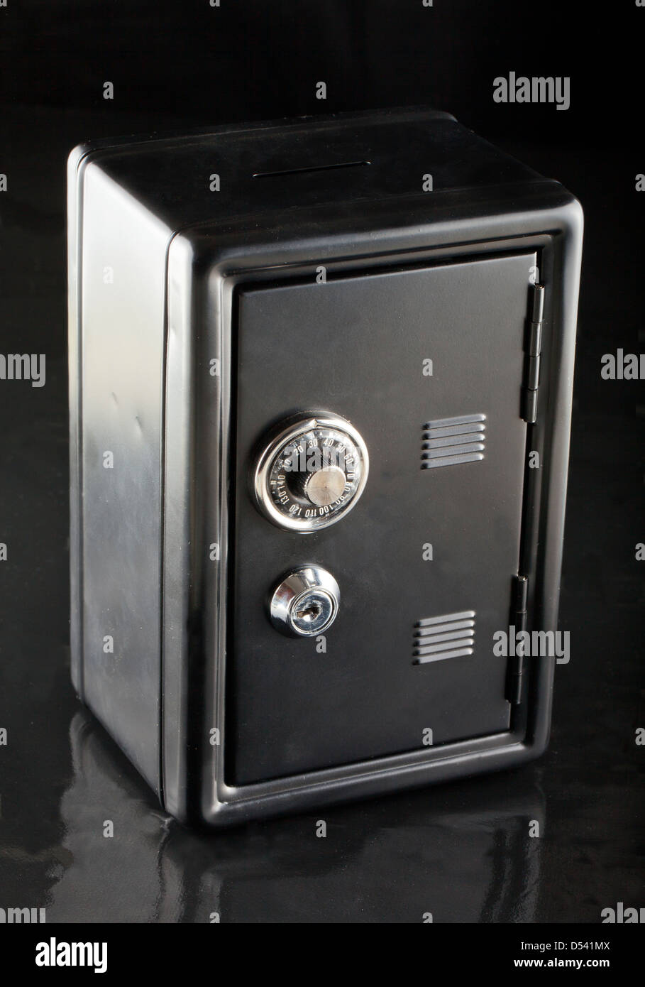 Entire view of a black strongbox over black background Stock Photo - Alamy