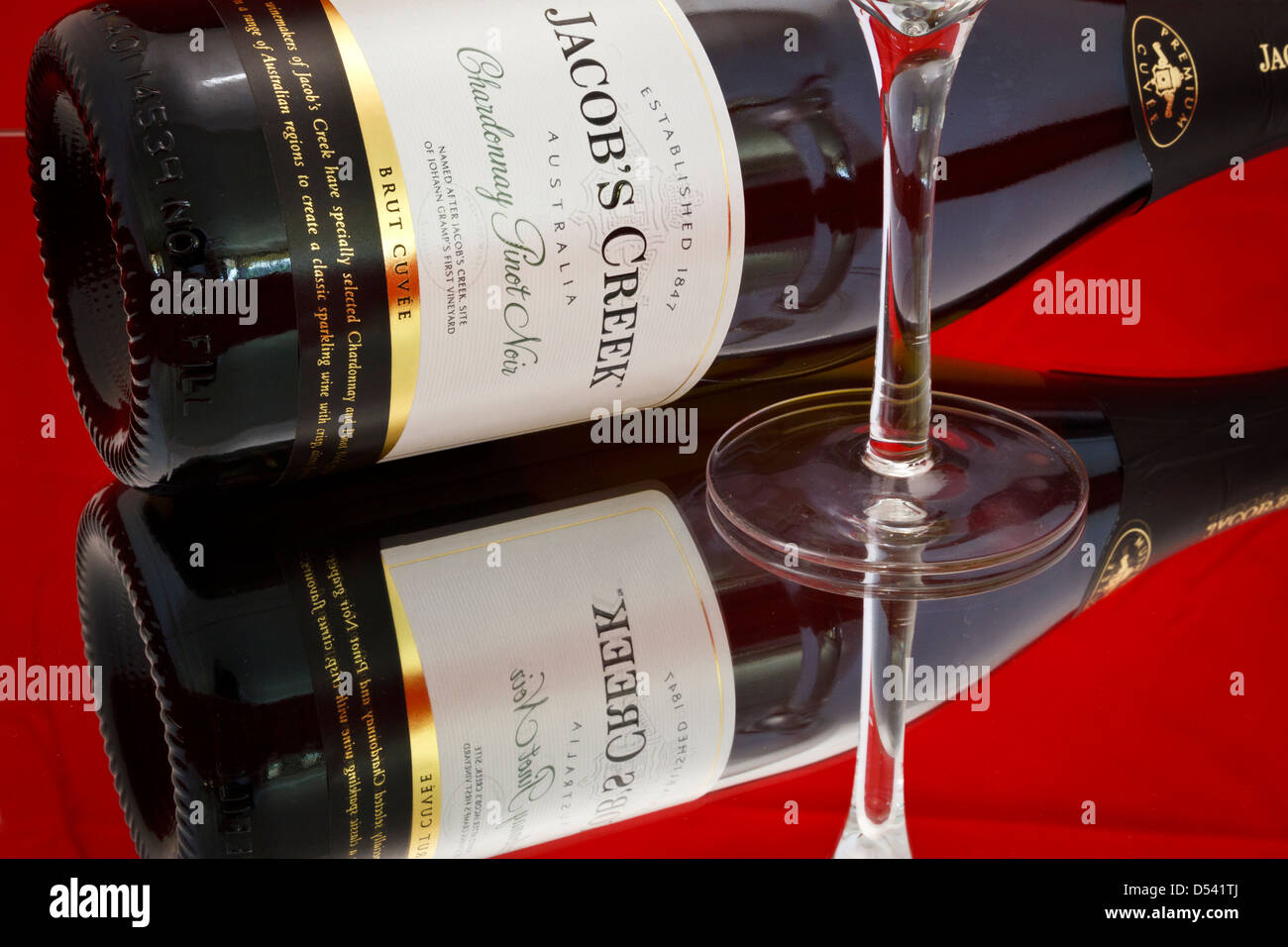 Wine bottle reflected on a mirror Stock Photo - Alamy