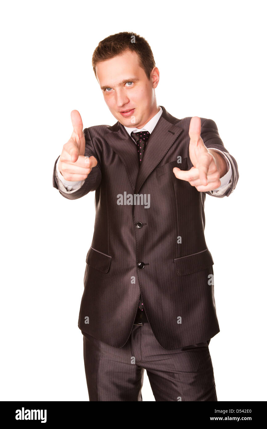 Happy young friendly smiling businessman pointing finger isolated on ...