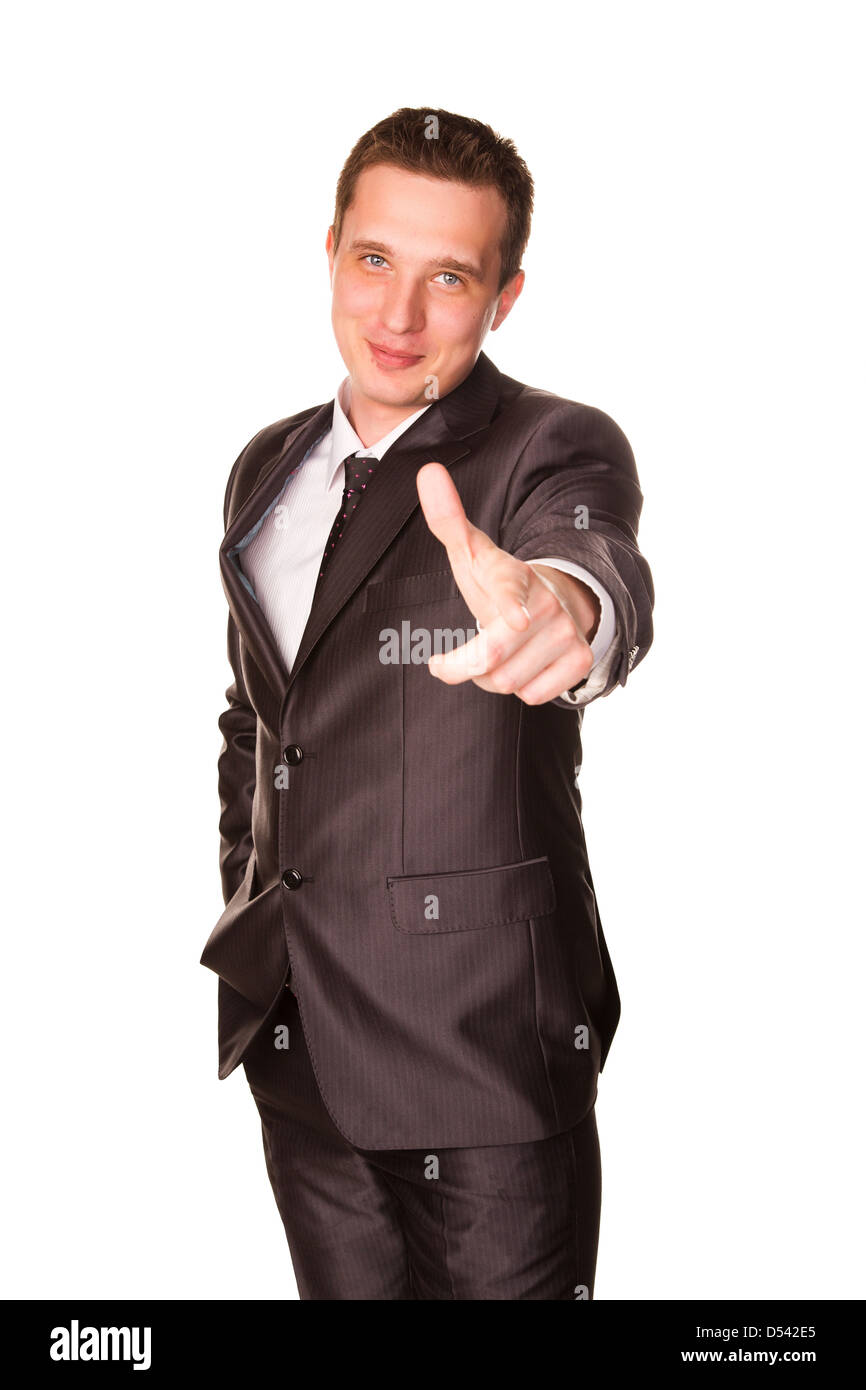Happy young friendly smiling businessman pointing finger isolated on ...