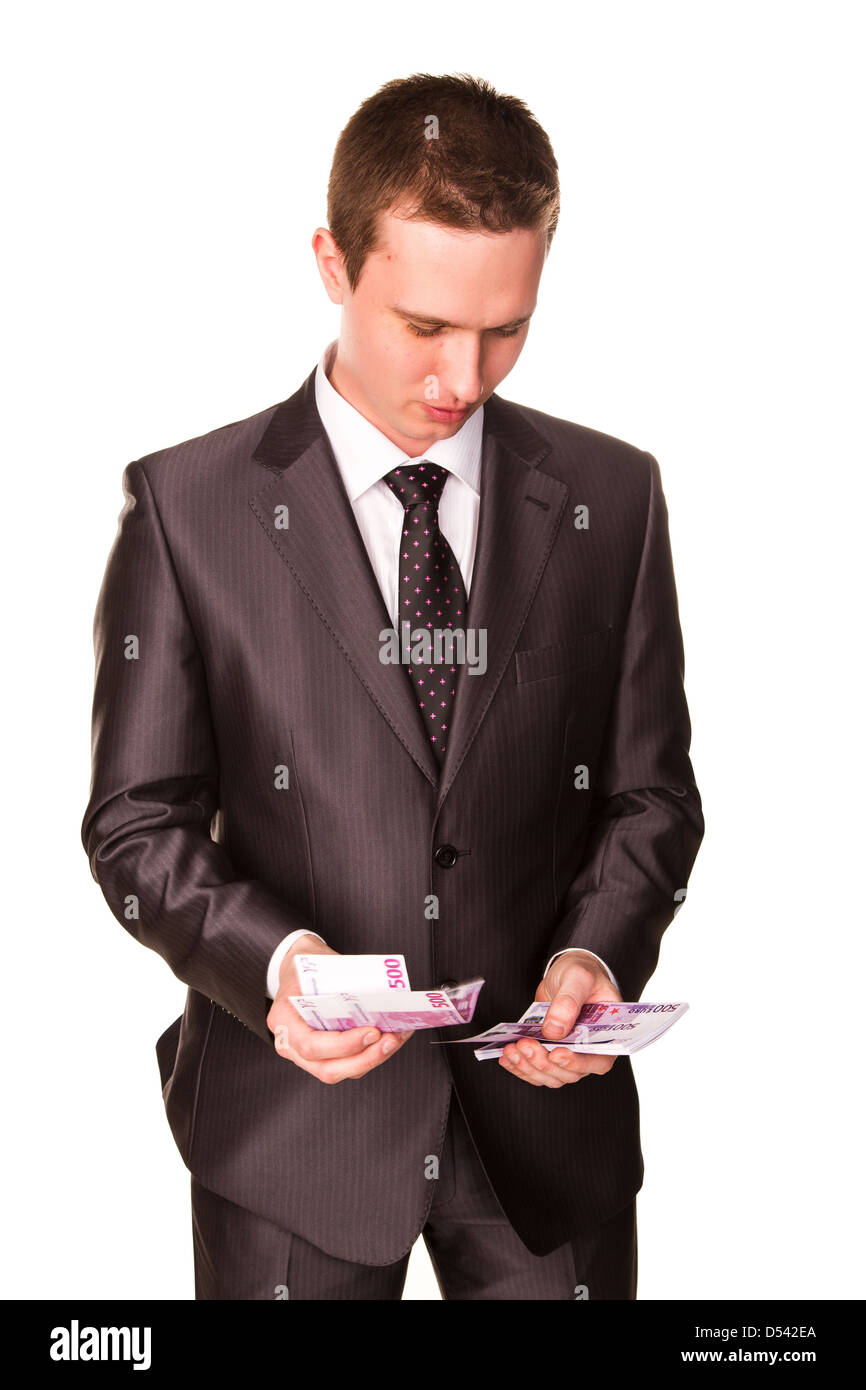 Young businessman counting money isolated on white background Stock ...