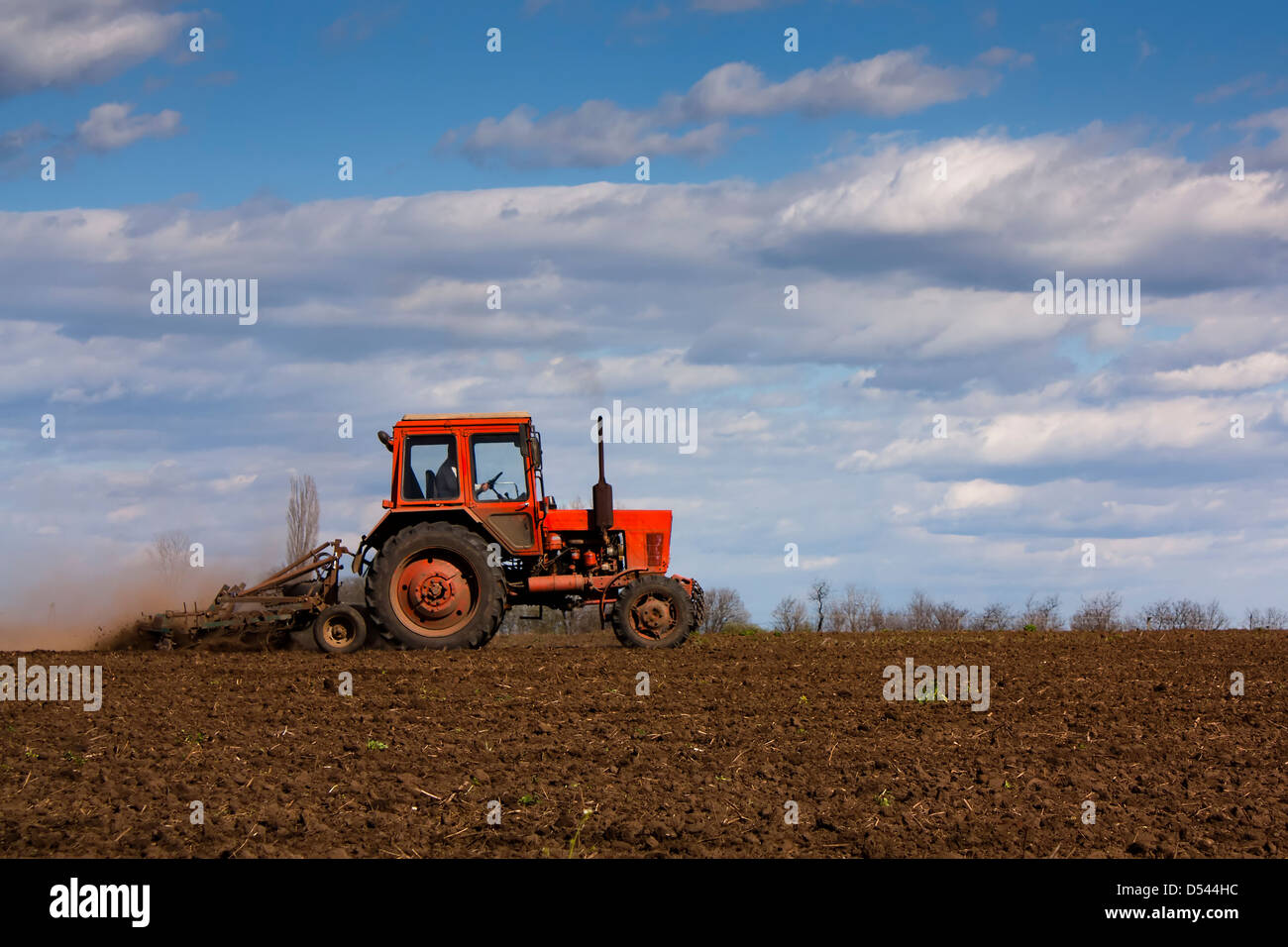 Tractor Tilling Field Stock Photo - Alamy