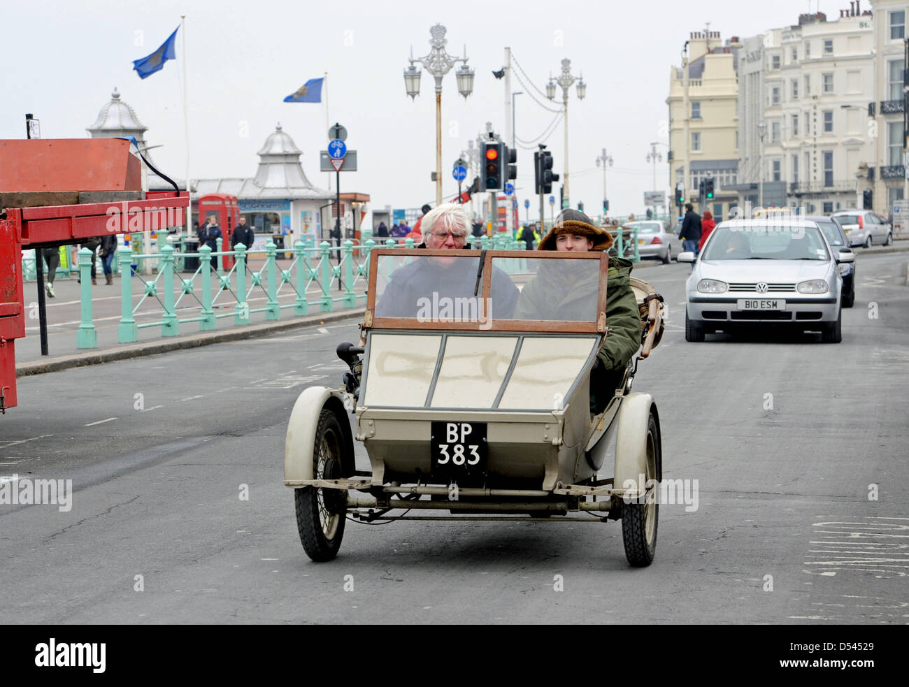 A vintage three wheeled motorcycle heads along Brighton seafront today ...