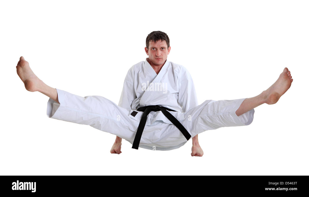 Karate. Man in a kimono with a white background Stock Photo - Alamy