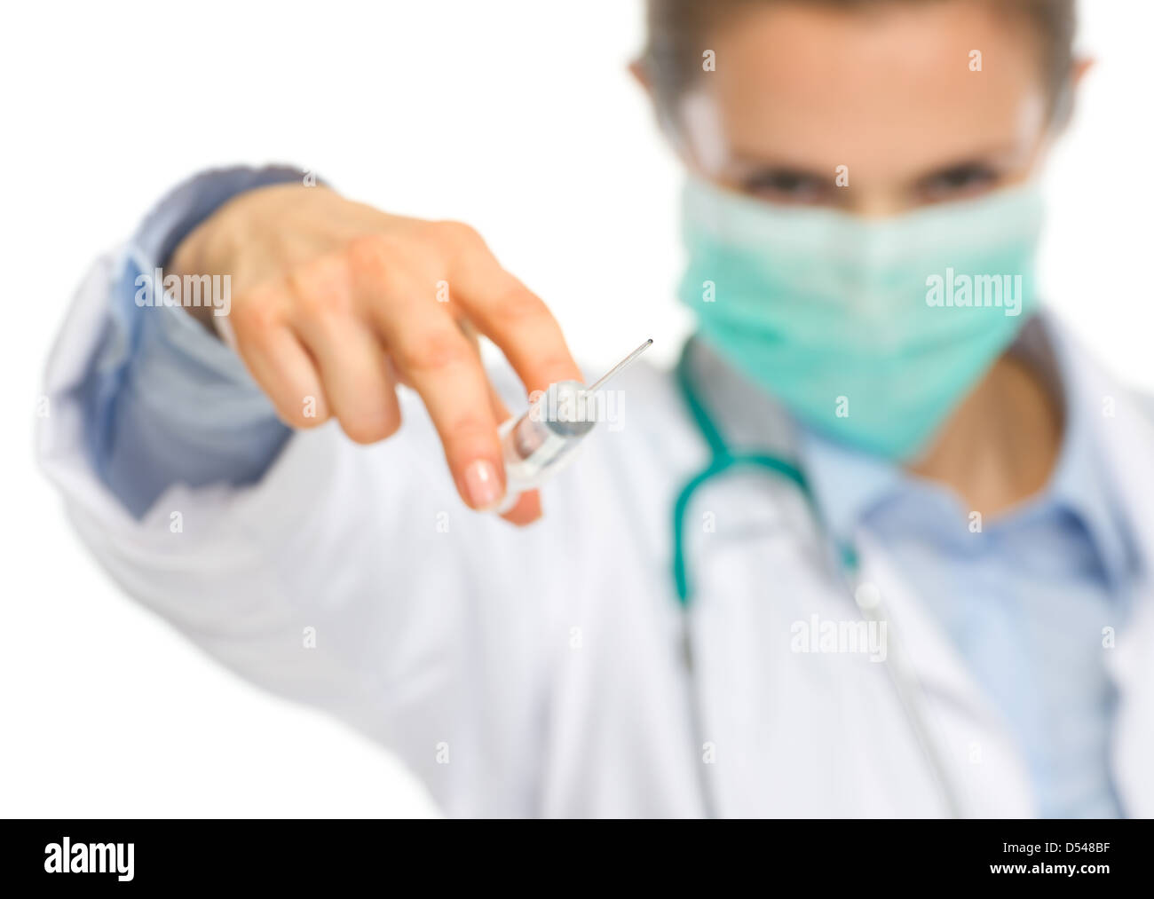 Scary medical doctor woman in mask using syringe Stock Photo - Alamy
