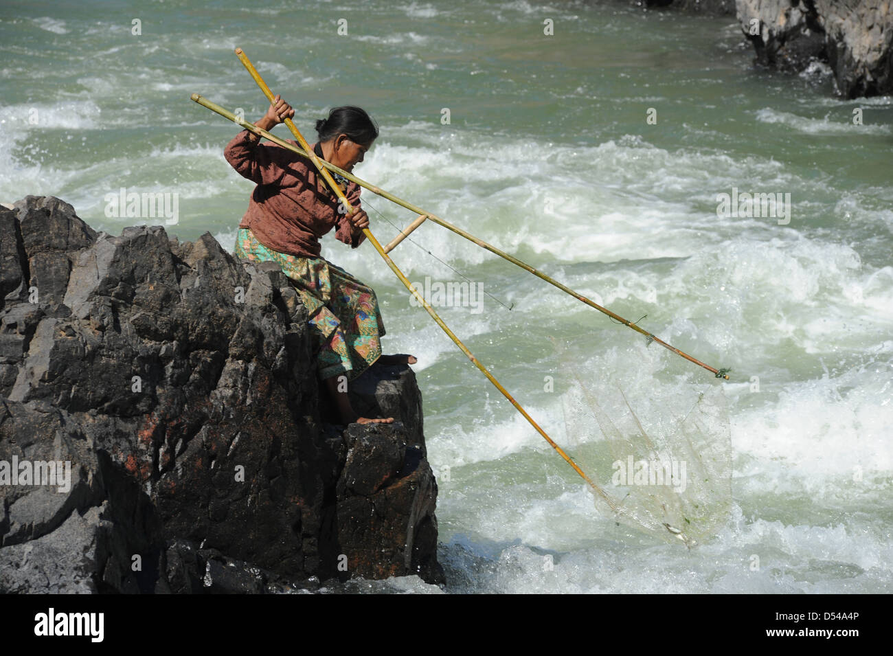 Fisherman fishing on river Mekong on Laos Stock Photo - Alamy