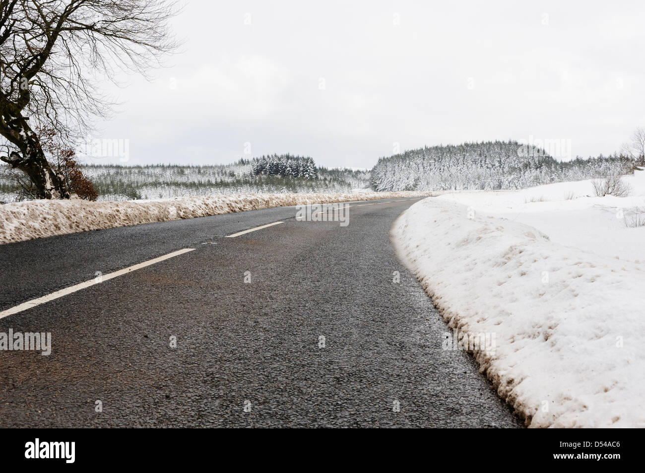 A rural road which has recently been cleared of snow Stock Photo - Alamy