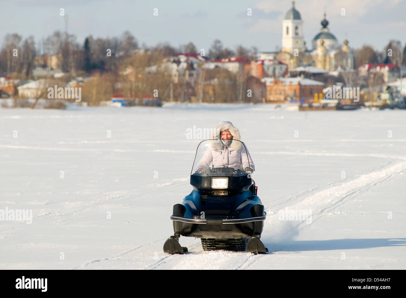 Girl on snowmobile hi-res stock photography and images - Alamy