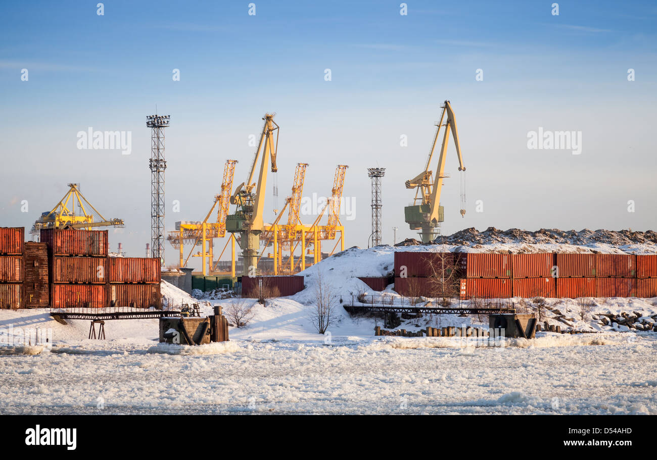 Cargo port in winter. Containers poles and cranes. St.Petersburg ...