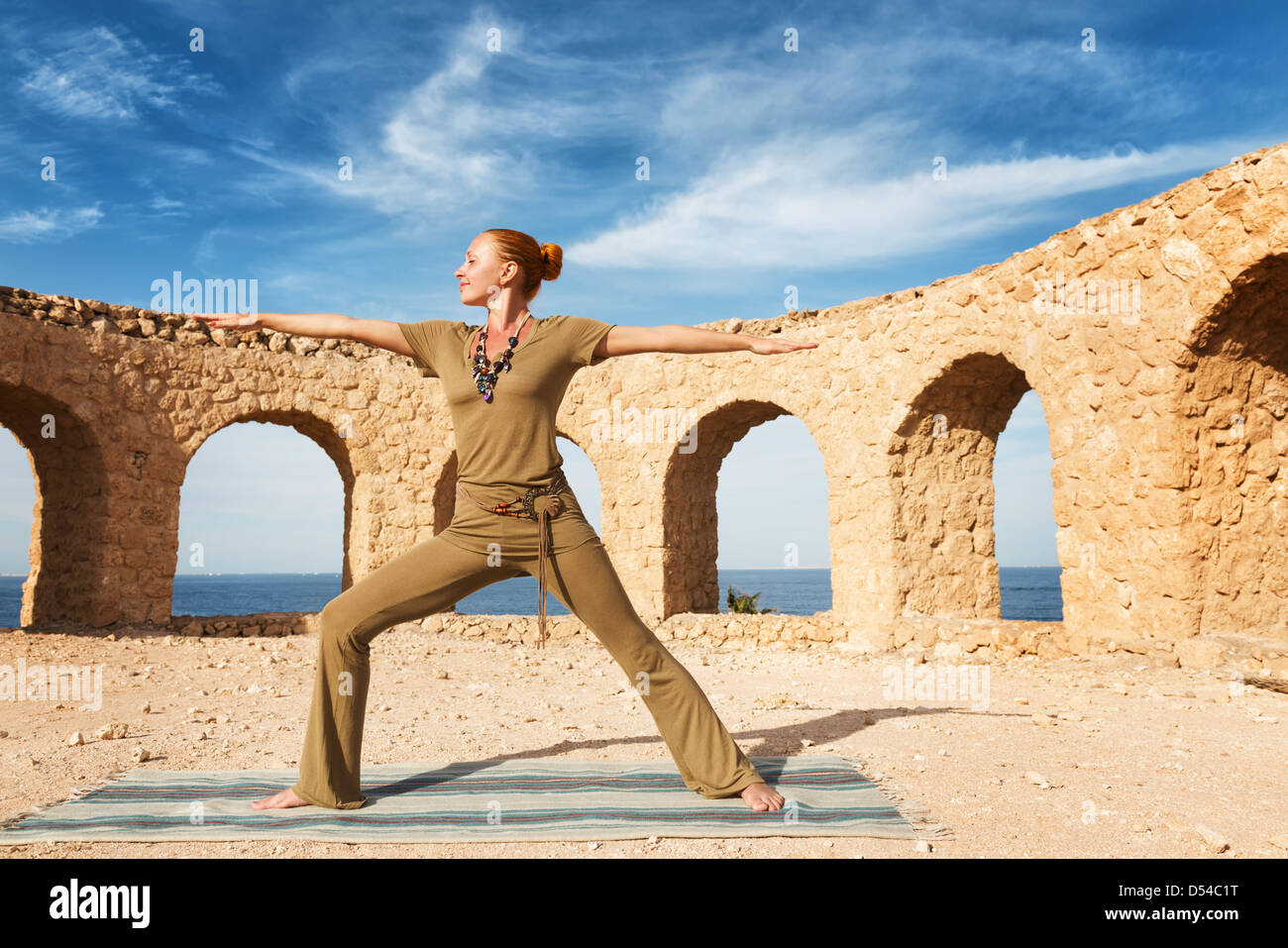Young woman practicing yoga [red haired] [Red sea] [Russian Ethnicity ...