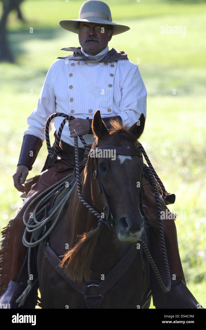 A cowboy riding a Quarter horse Stock Photo - Alamy