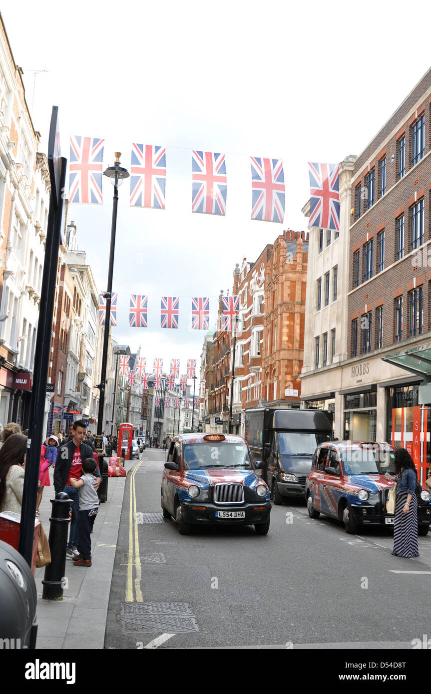 Decorated GB flag Taxi on road in covent garden London during the ...