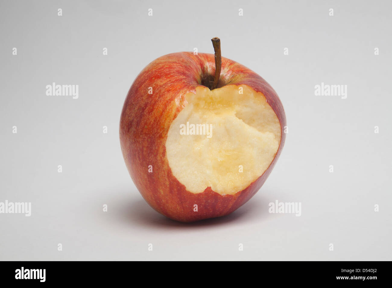 Bitten apple representing control in eating Stock Photo - Alamy