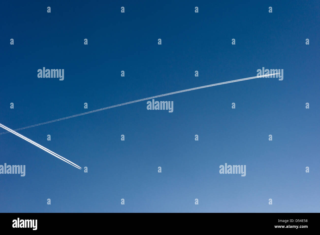 Berlin, Germany, contrails draw a pattern in the sky Stock Photo - Alamy