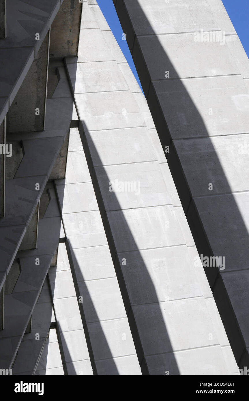 a detail of modern concrete architecture as part of the exterior of a ...