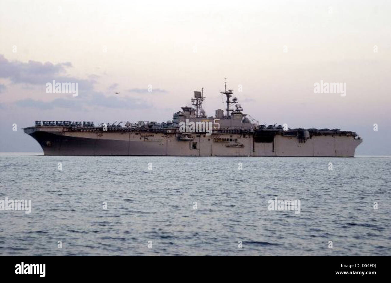 USS Bataan (LHD-5), an amphibious assault ship, operates in the Arabian ...