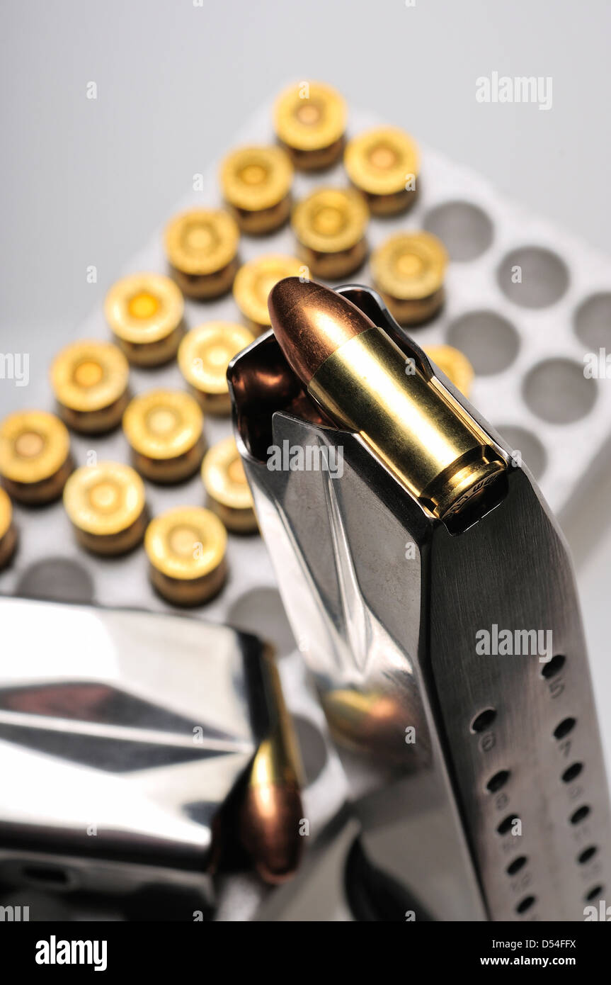 Loaded 9 mm/16 round semi-automatic magazines or clips with box of ...