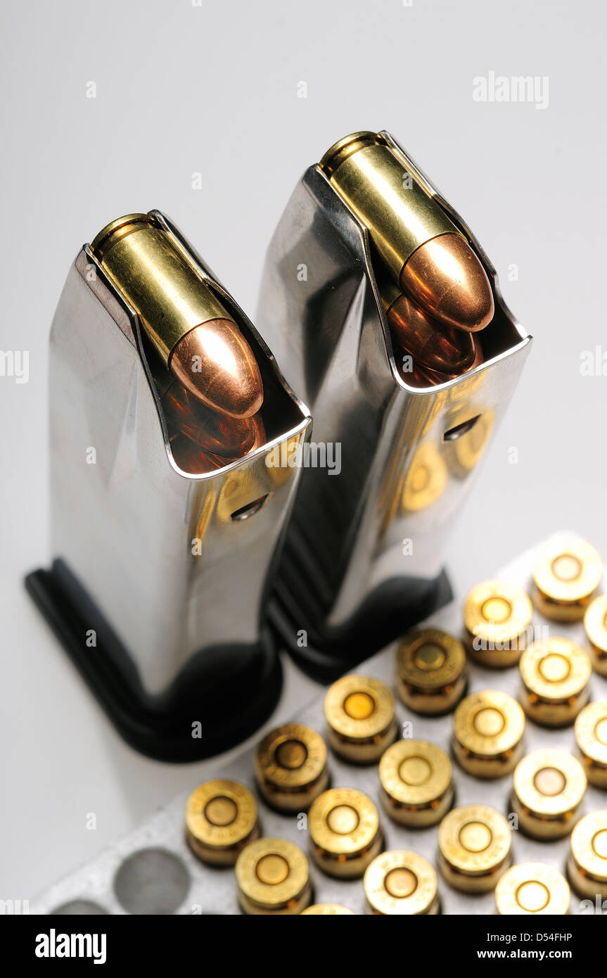 Loaded 9 mm/16 round semi-automatic magazines or clips with box of ...