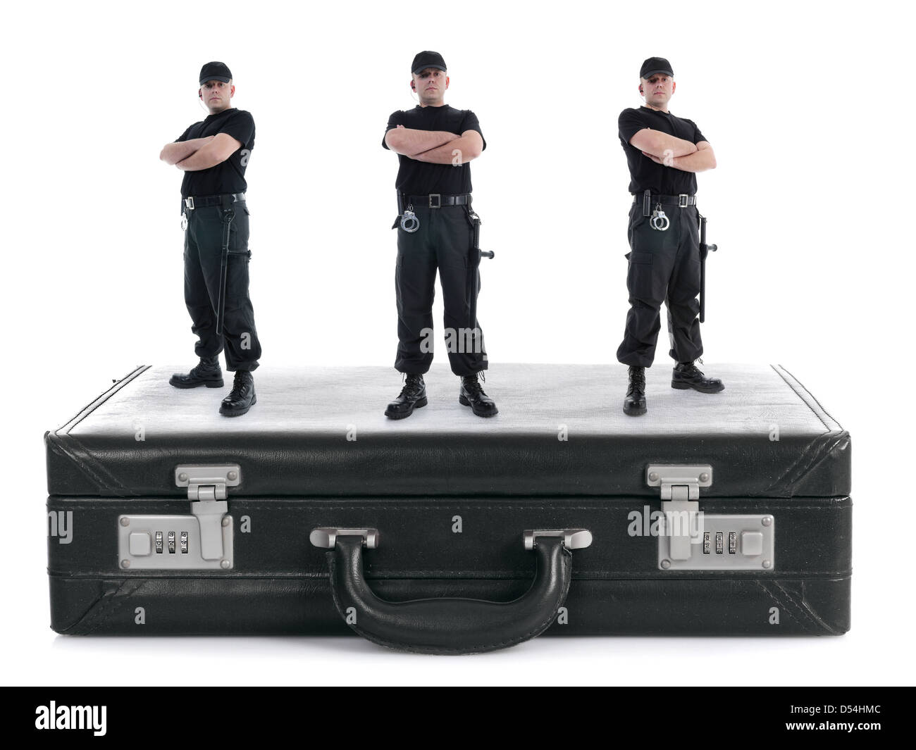 Three security guys standing on black cipher suitcase shot on white ...