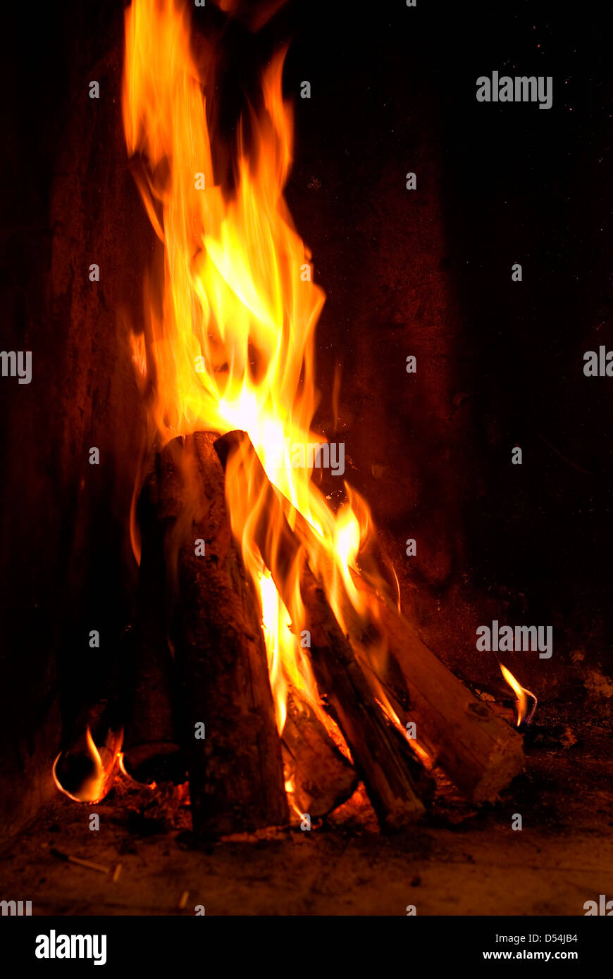 Log fire in a open fire place, hdr photo Stock Photo - Alamy
