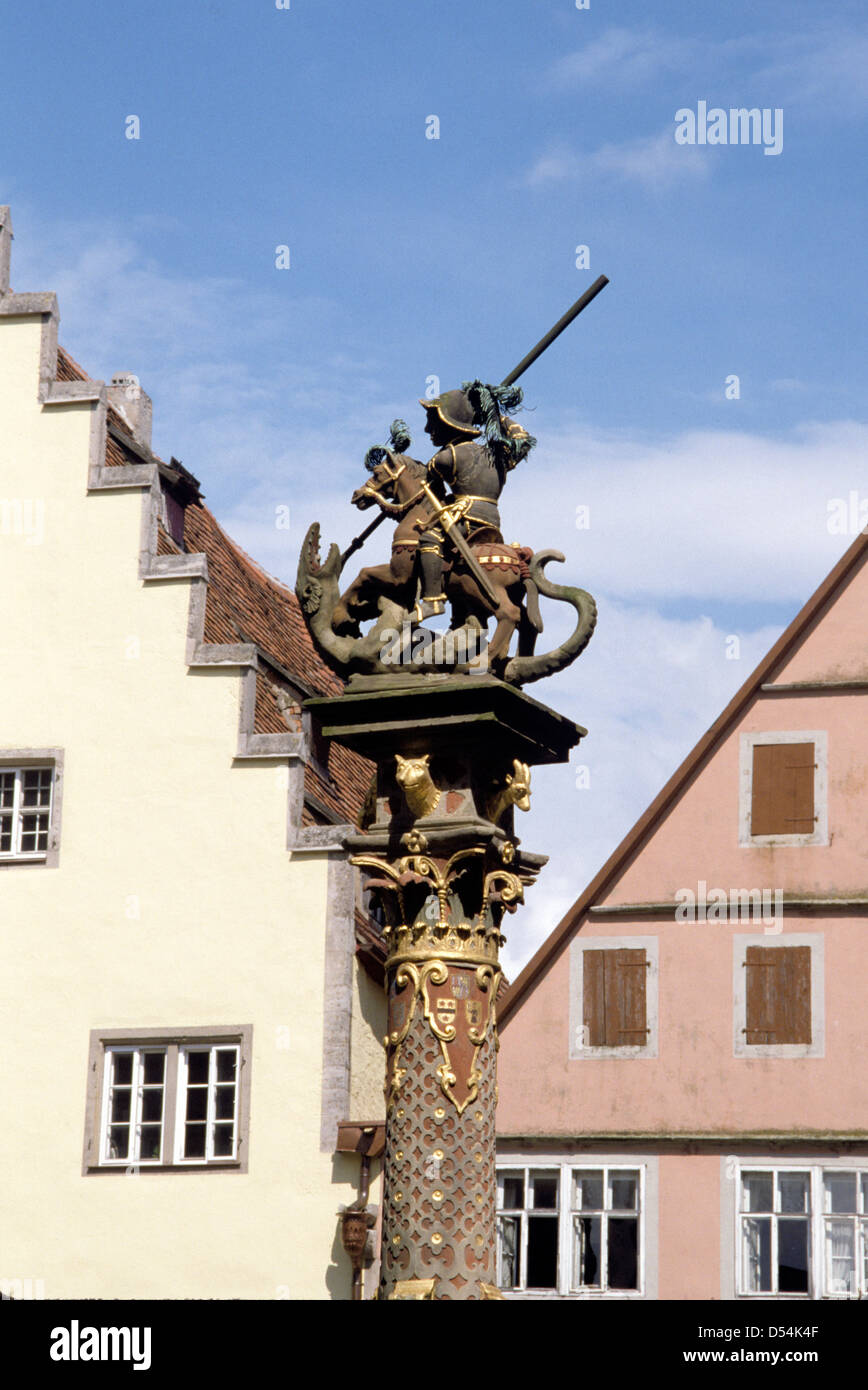 statue and medieval architecture in old town of Rothenburg ob der ...