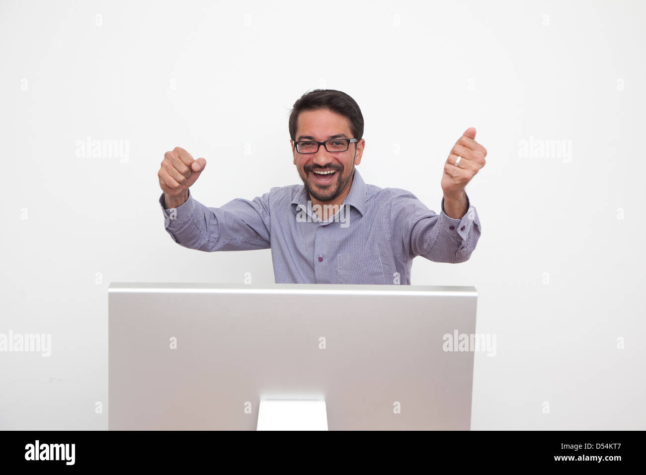 Freiburg, Germany, businessman cheering in front of a computer Stock ...