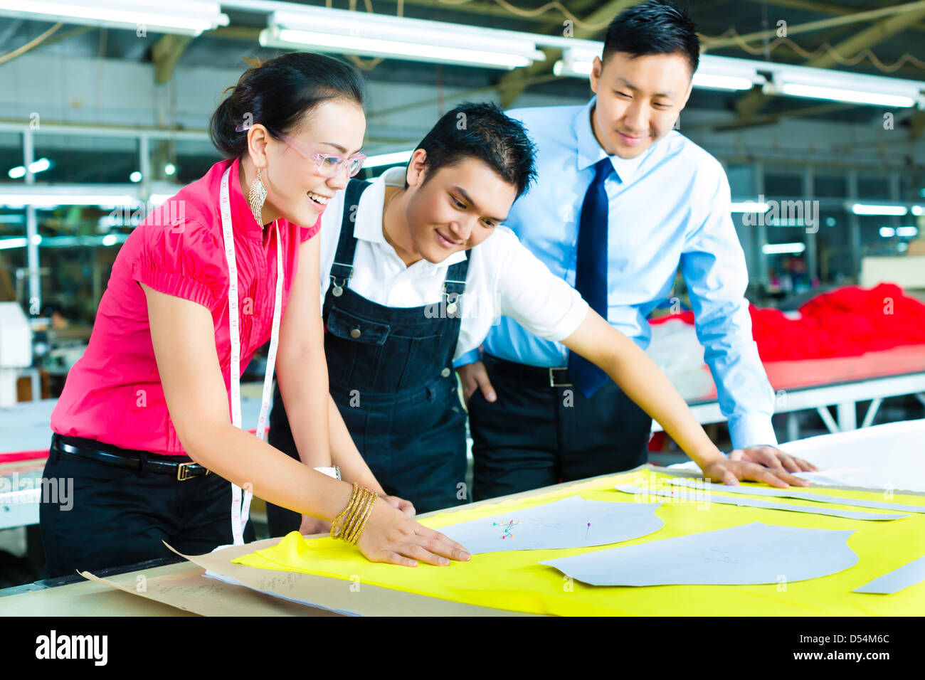 Worker, Dressmaker and CEO in a factory Stock Photo - Alamy