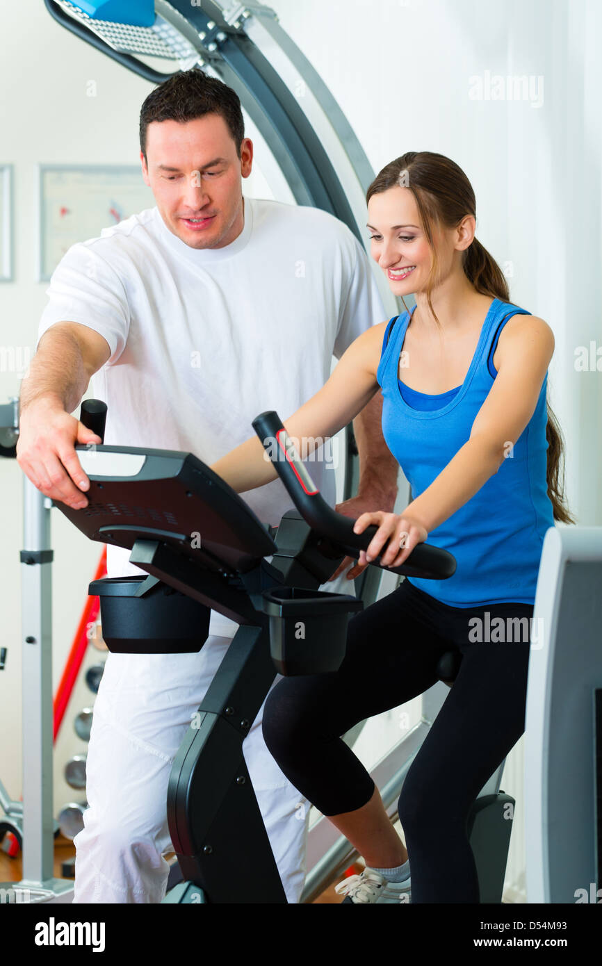 Patient at the physiotherapy making physical exercises with her ...
