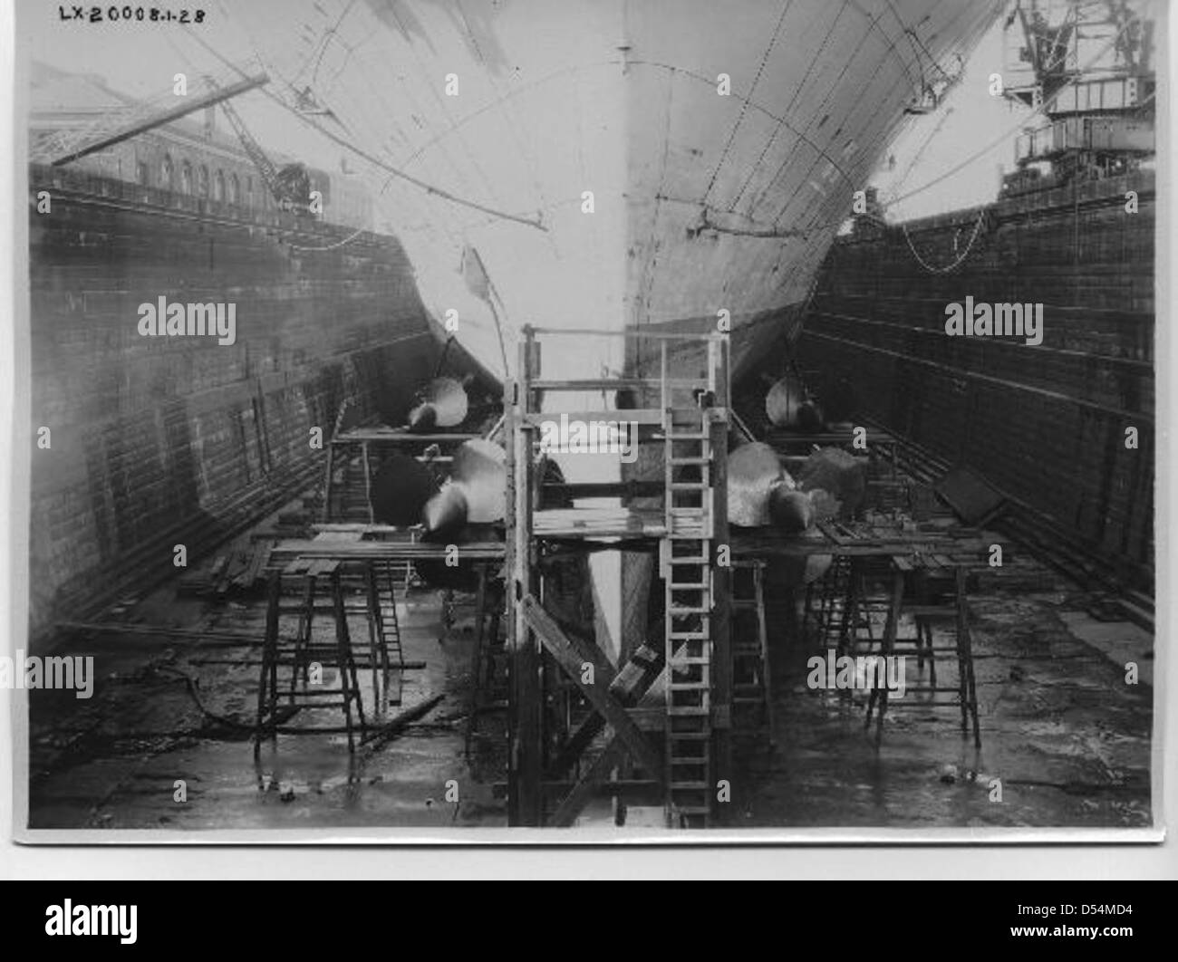 The USS Lexington (CV-2) undergoing maintenance in a dry dock ...