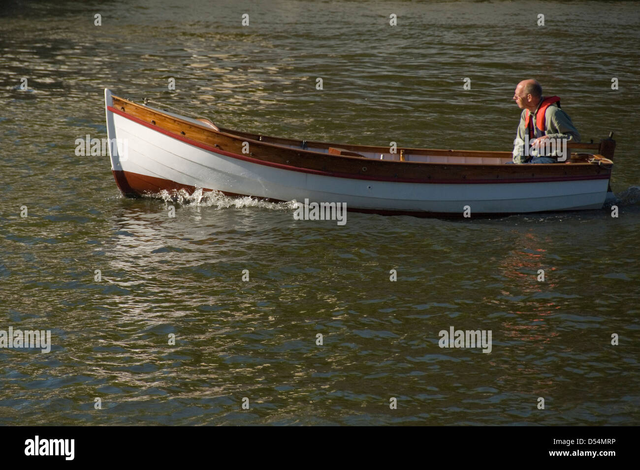 Man in a small motorboat, Bristol harbour, England, UK Stock Photo - Alamy