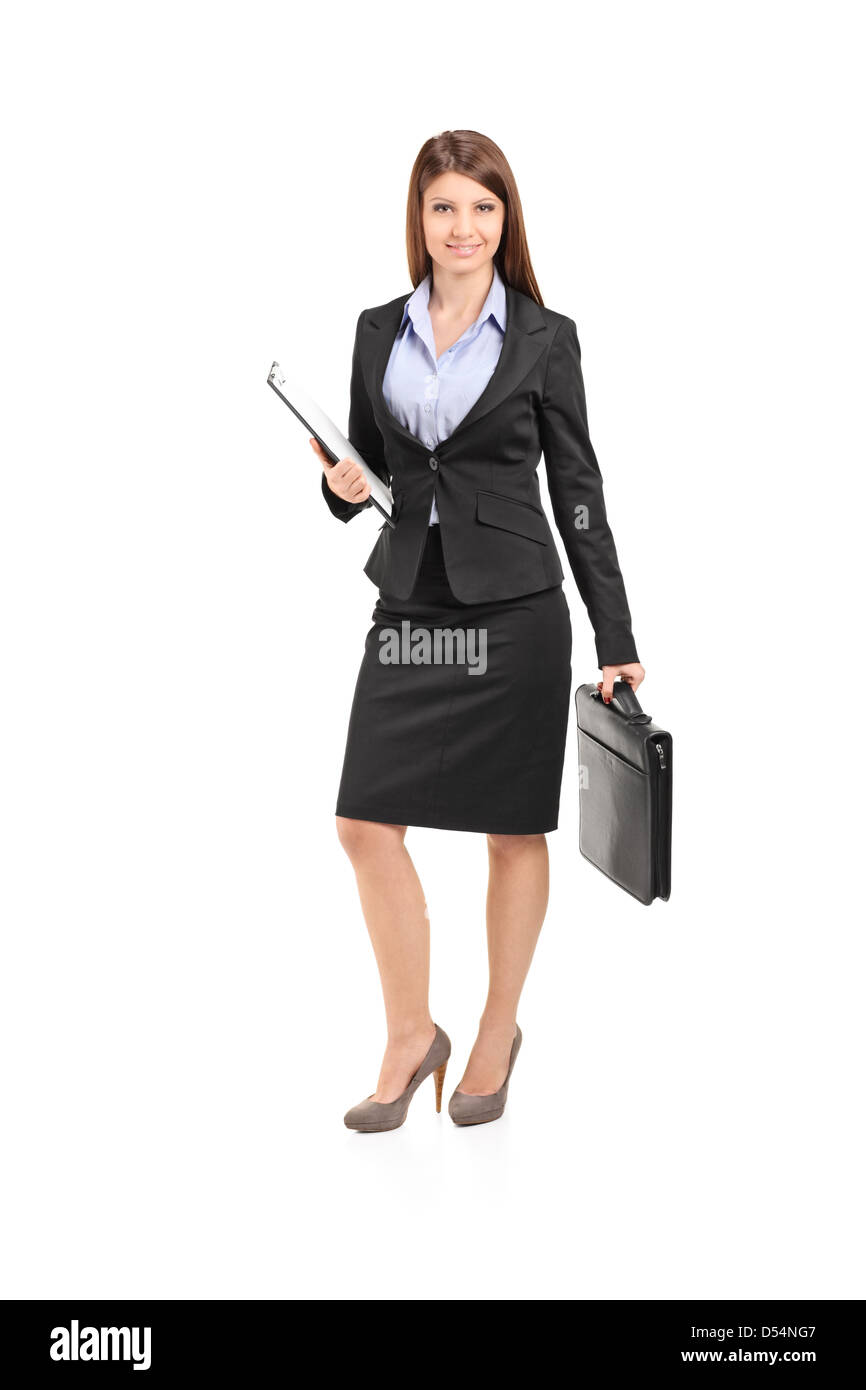Full length portrait of a businesswoman with clipboard holding a ...