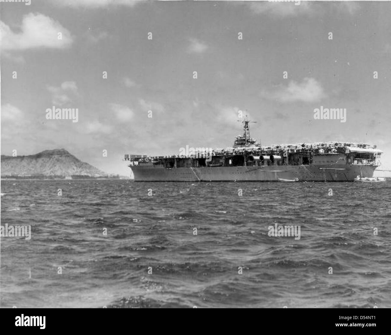 The USS CV-4, an aircraft carrier, is anchored off the coast of ...